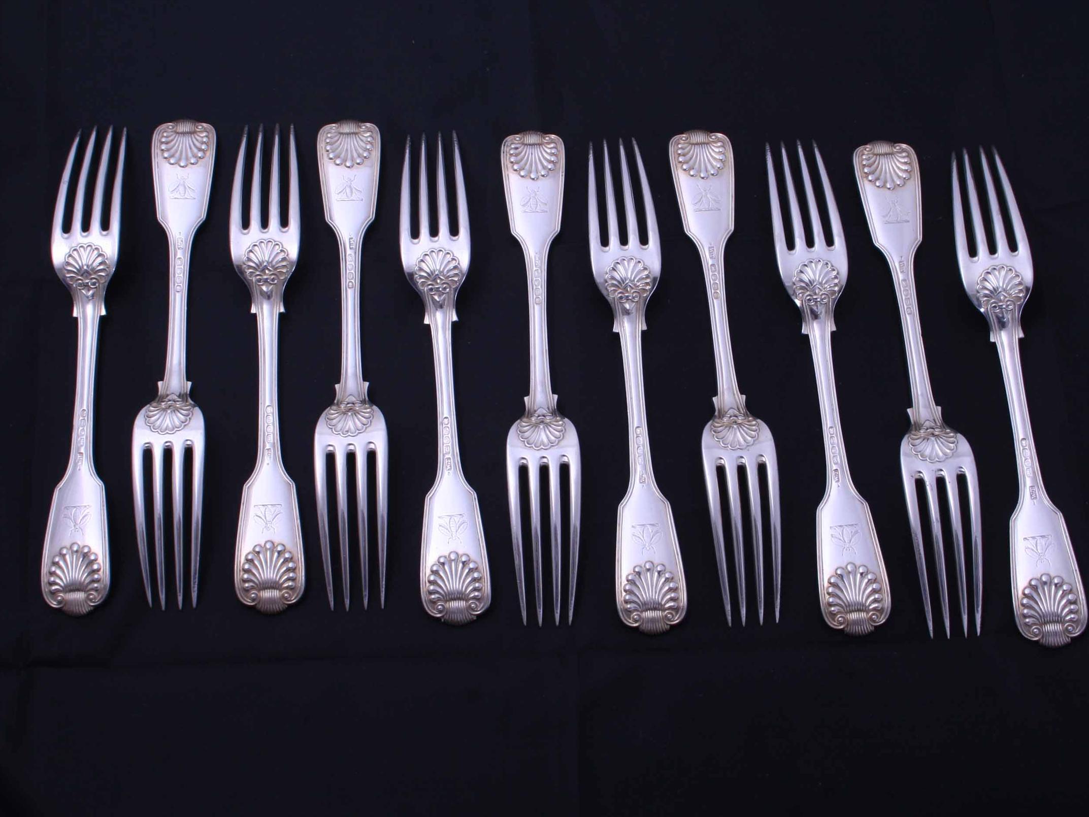 Set of eleven William IV fiddle, thread and shell pattern sterling silver table forks ...