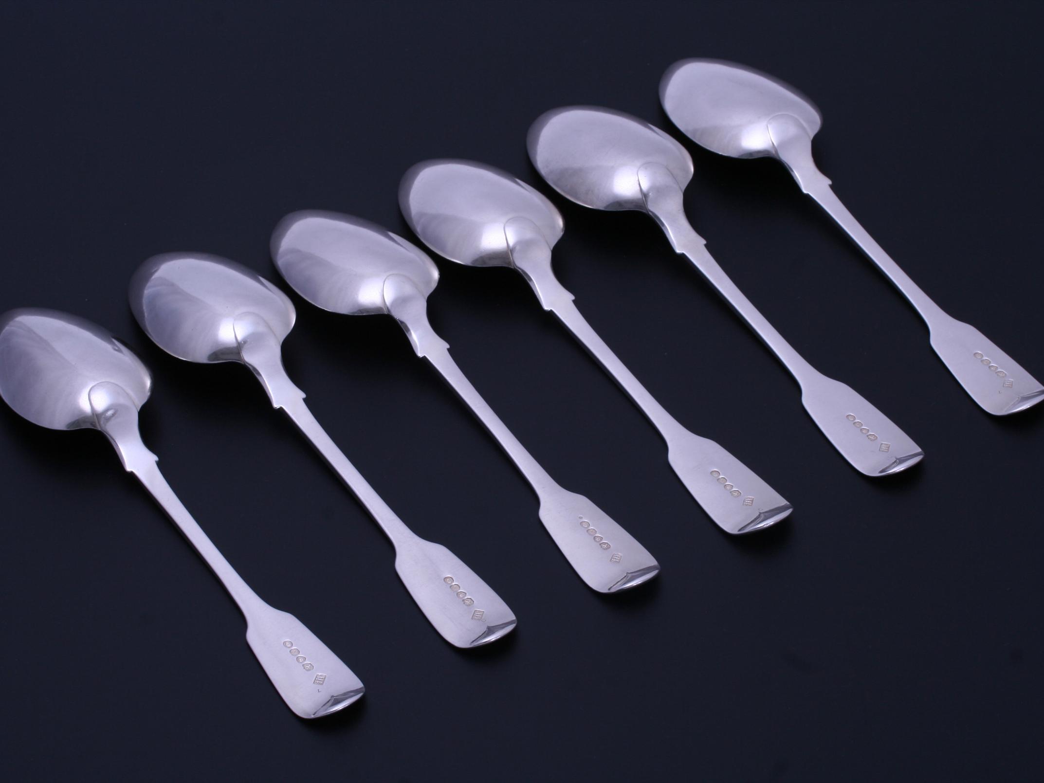 A set of six William IV sterling silver fiddle pattern table spoons ...