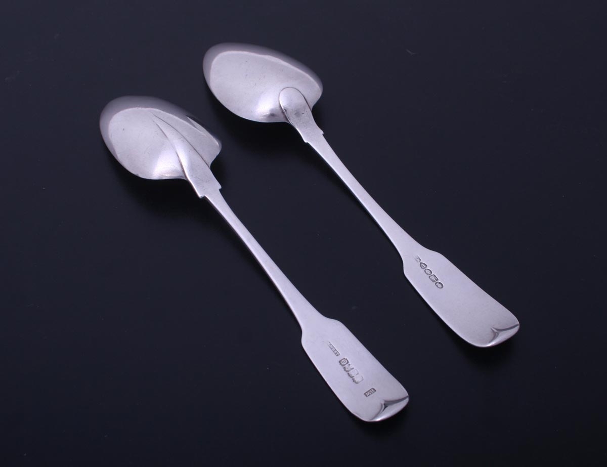 A matched pair of Regency Irish fiddle pattern sterling silver table ...