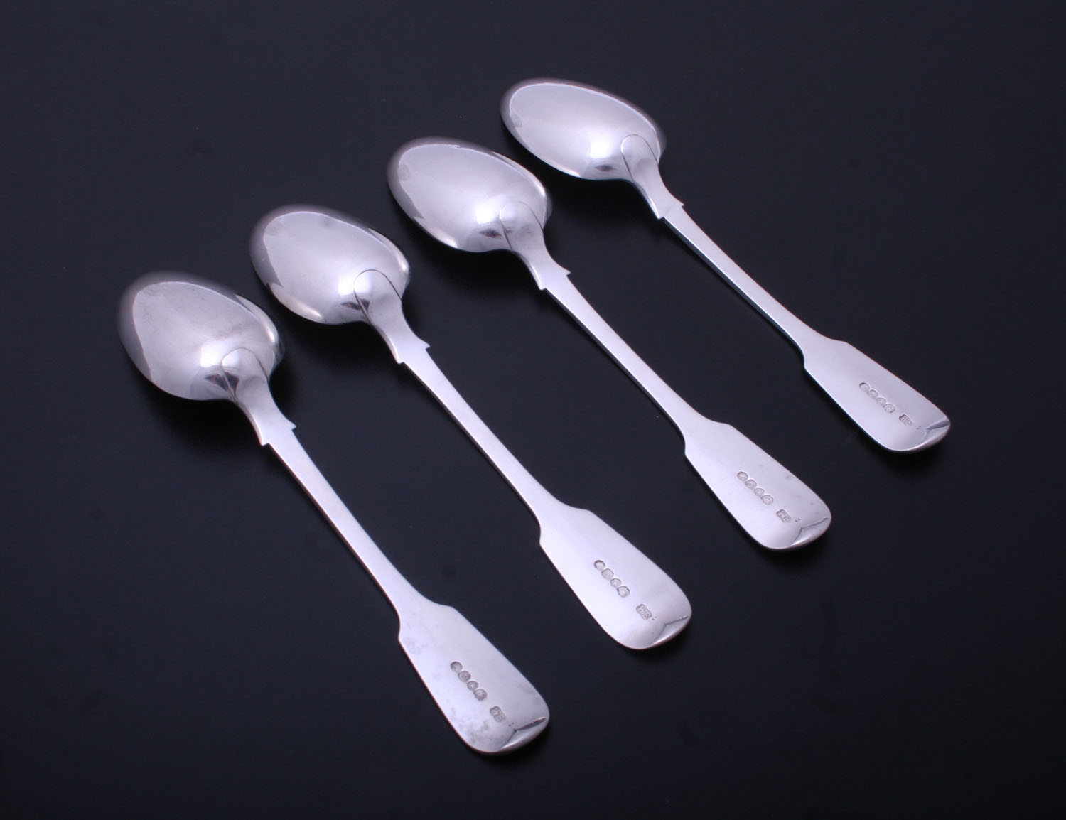 A set of four Victorian fiddle pattern sterling silver table spoons ...