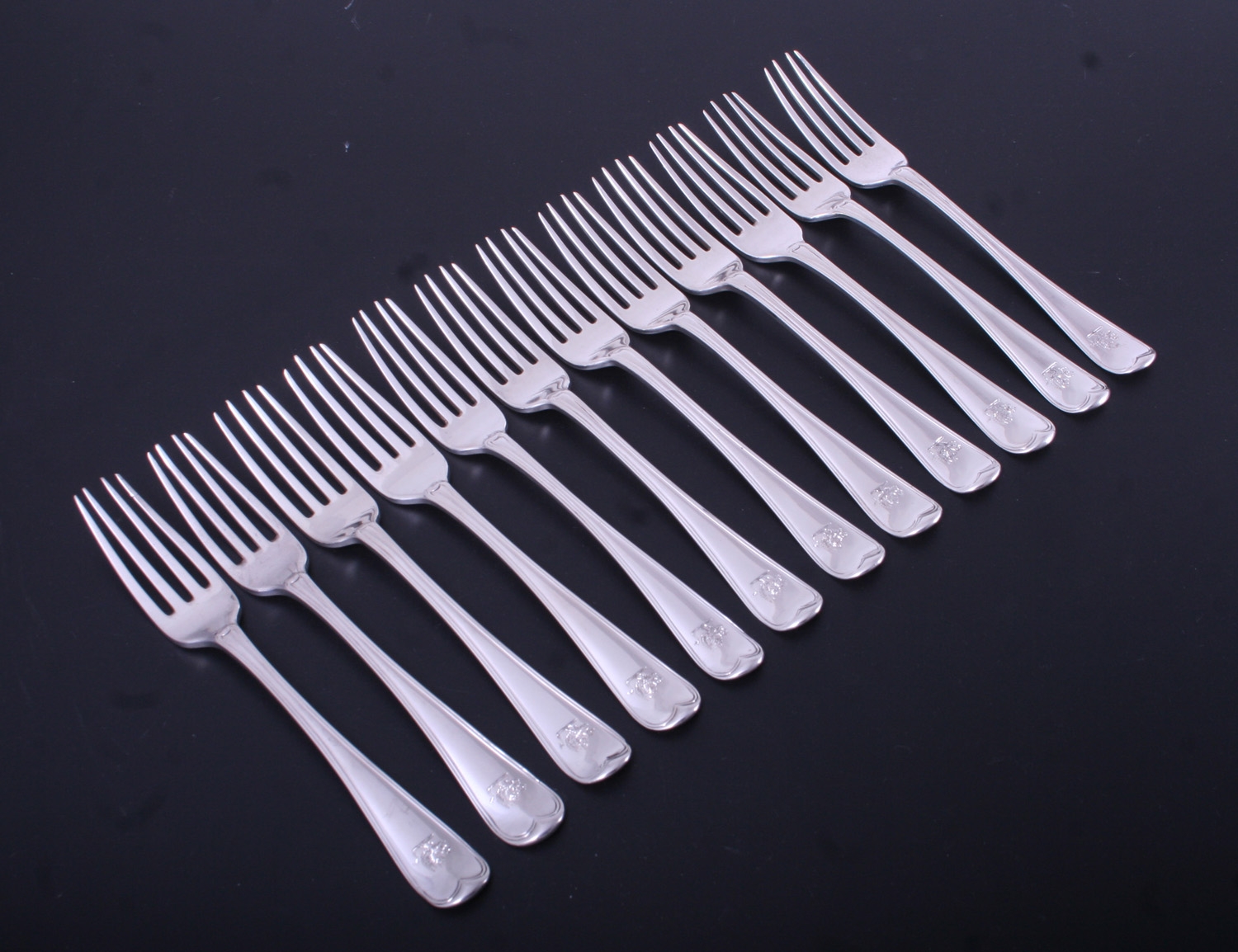 A matched set of twelve George III sterling silver Old English thread ...