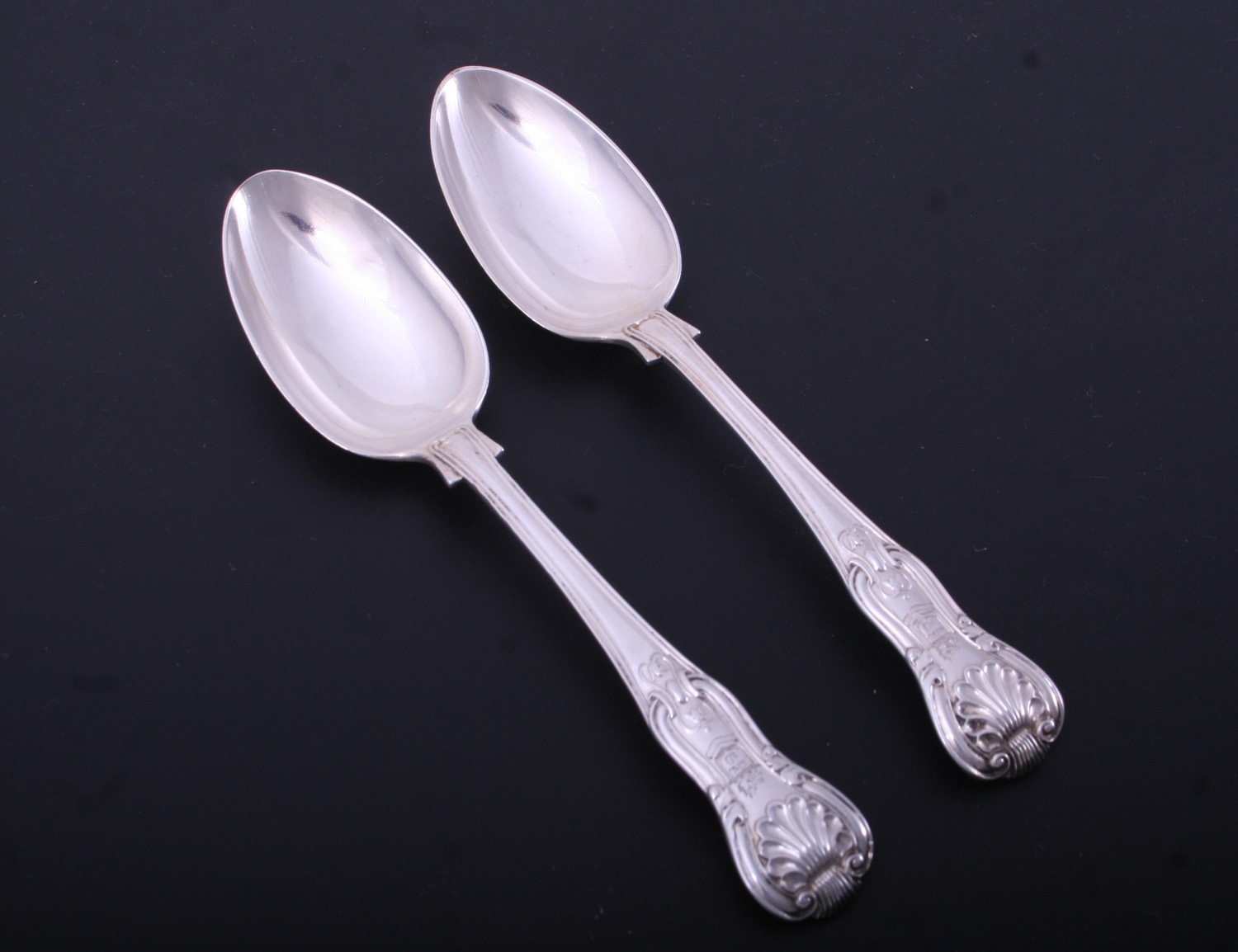 A pair of Victorian Hourglass pattern sterling silver dessert spoons ...