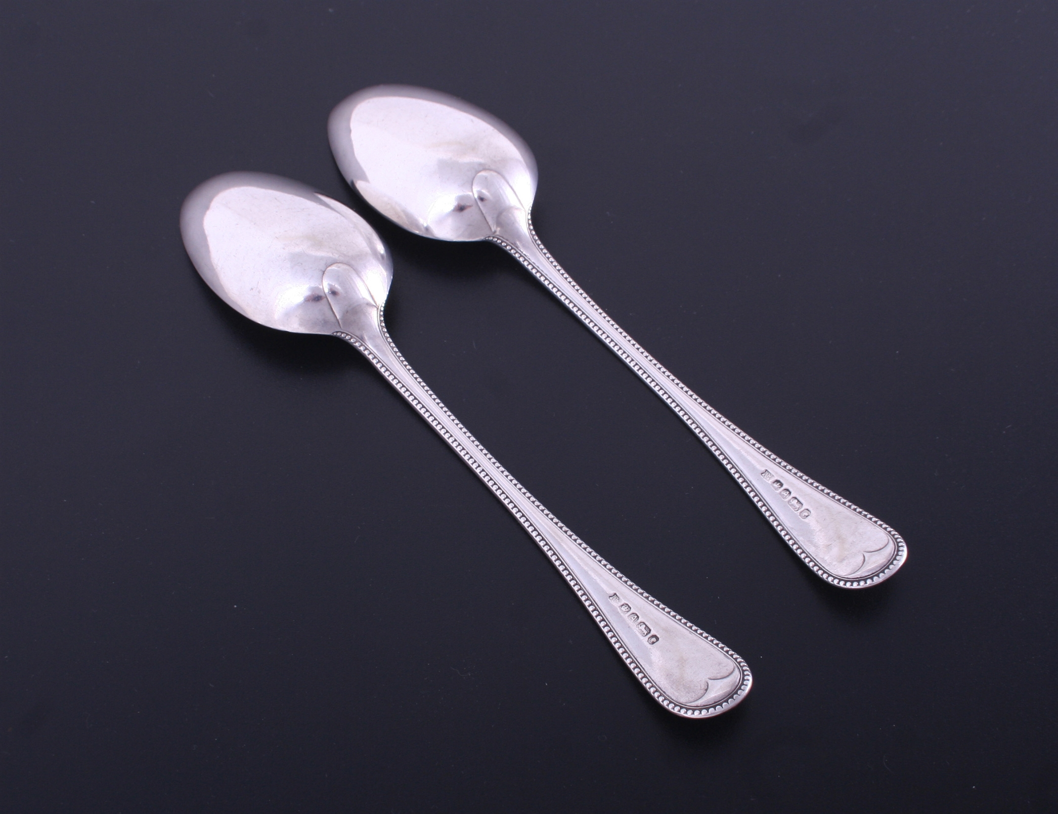 A pair of Victorian Old English bead edge sterling silver table spoons ...
