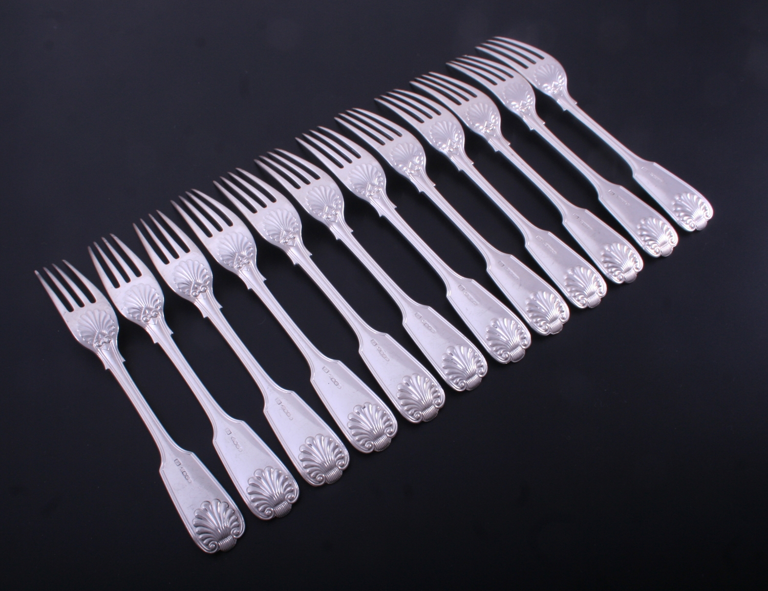 A set of twelve Irish Victorian fiddle, thread and shell pattern ...