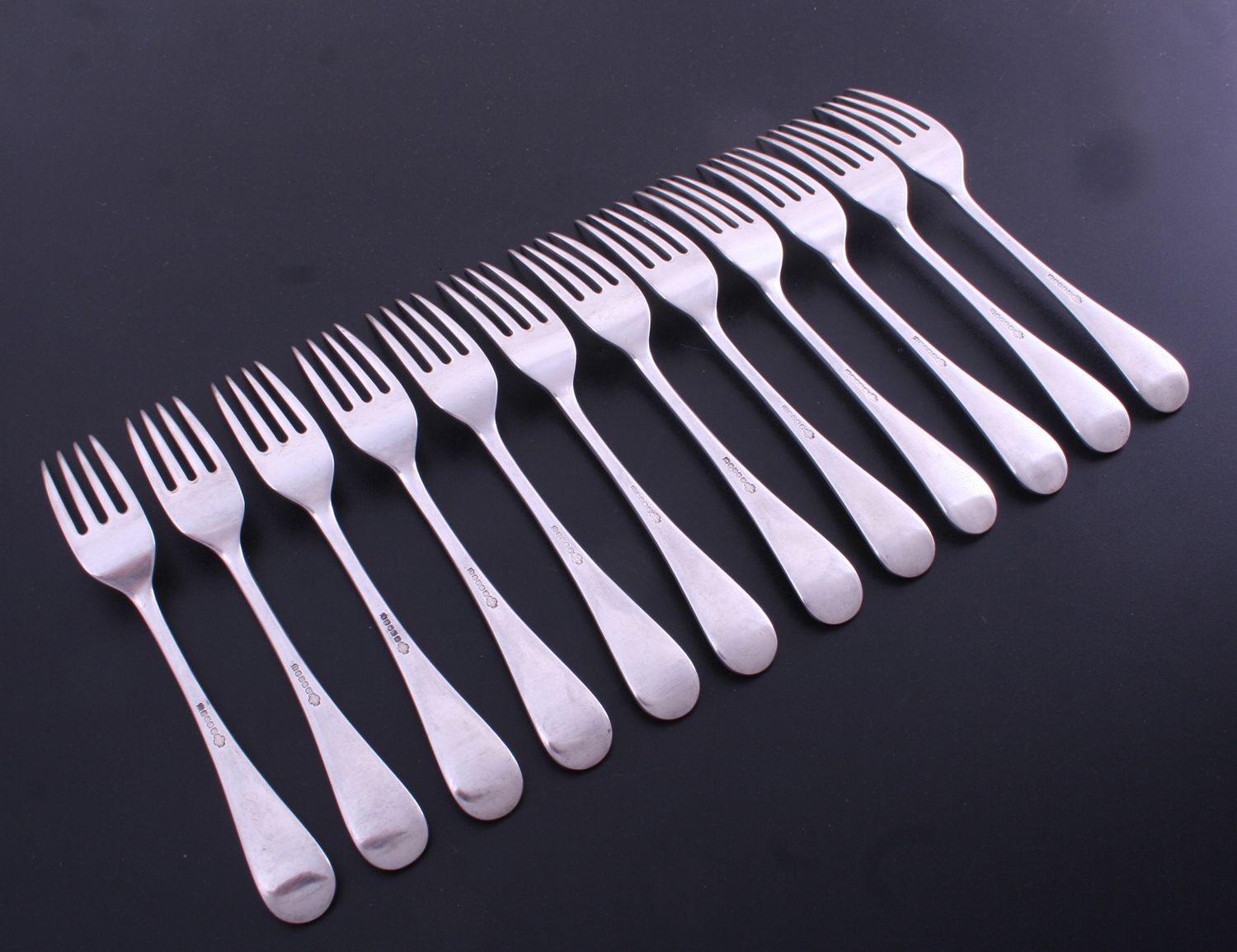 A set of twelve Victorian electroplate Old English silver table forks ...