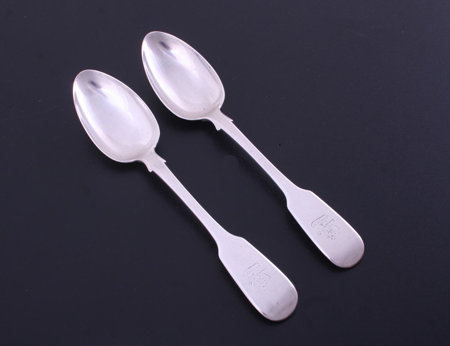 A pair of Victorian sterling silver fiddle pattern dessert spoons ...