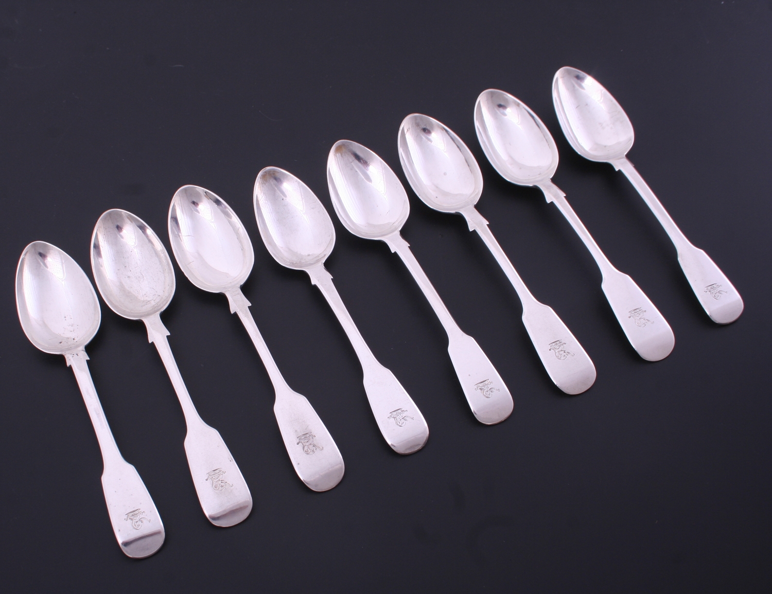 A matched set of eight George IV/Victorian fiddle pattern sterling ...